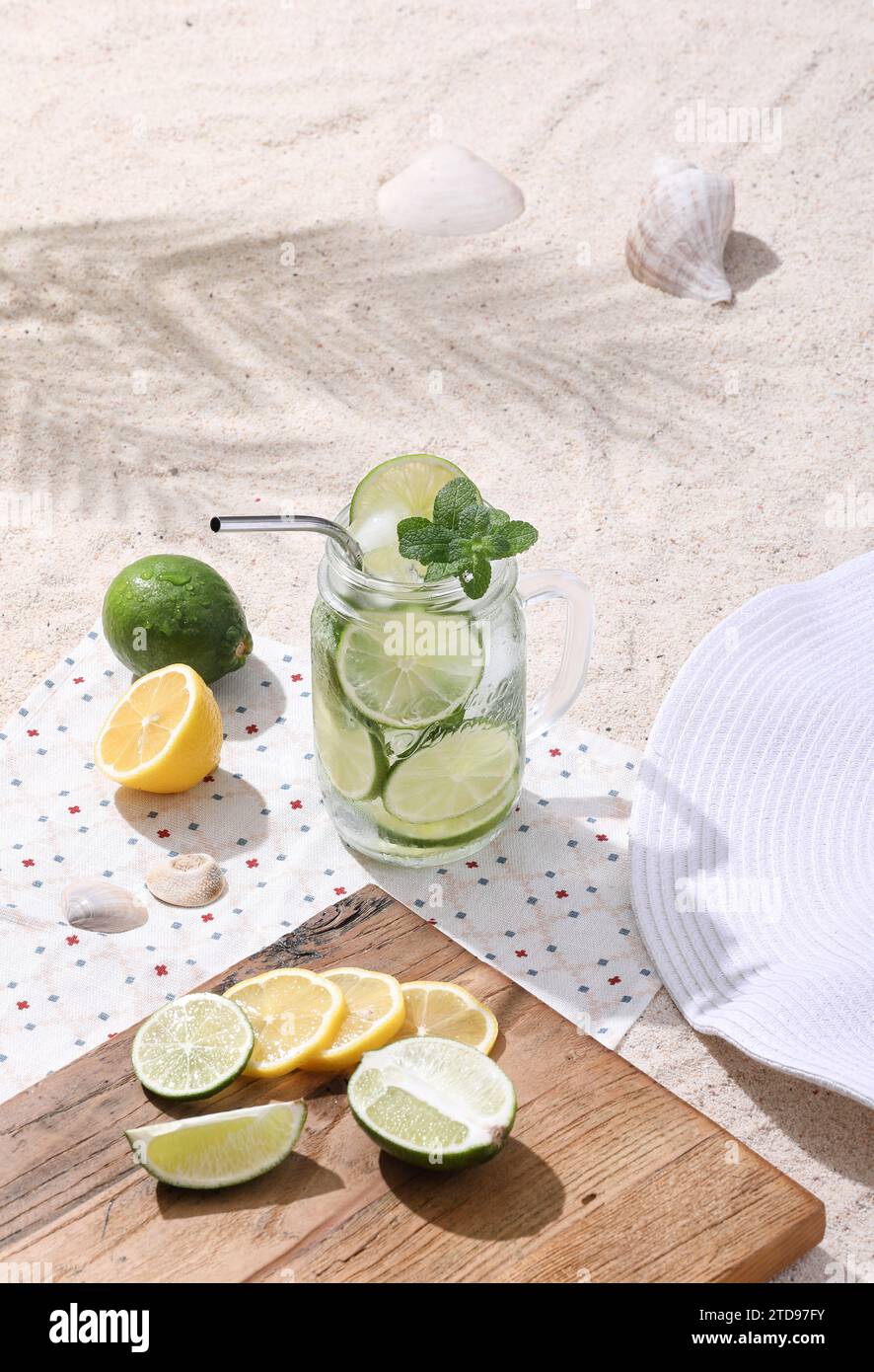 Cool cocktails and citrus fruits on the hot summer beach sand Stock ...