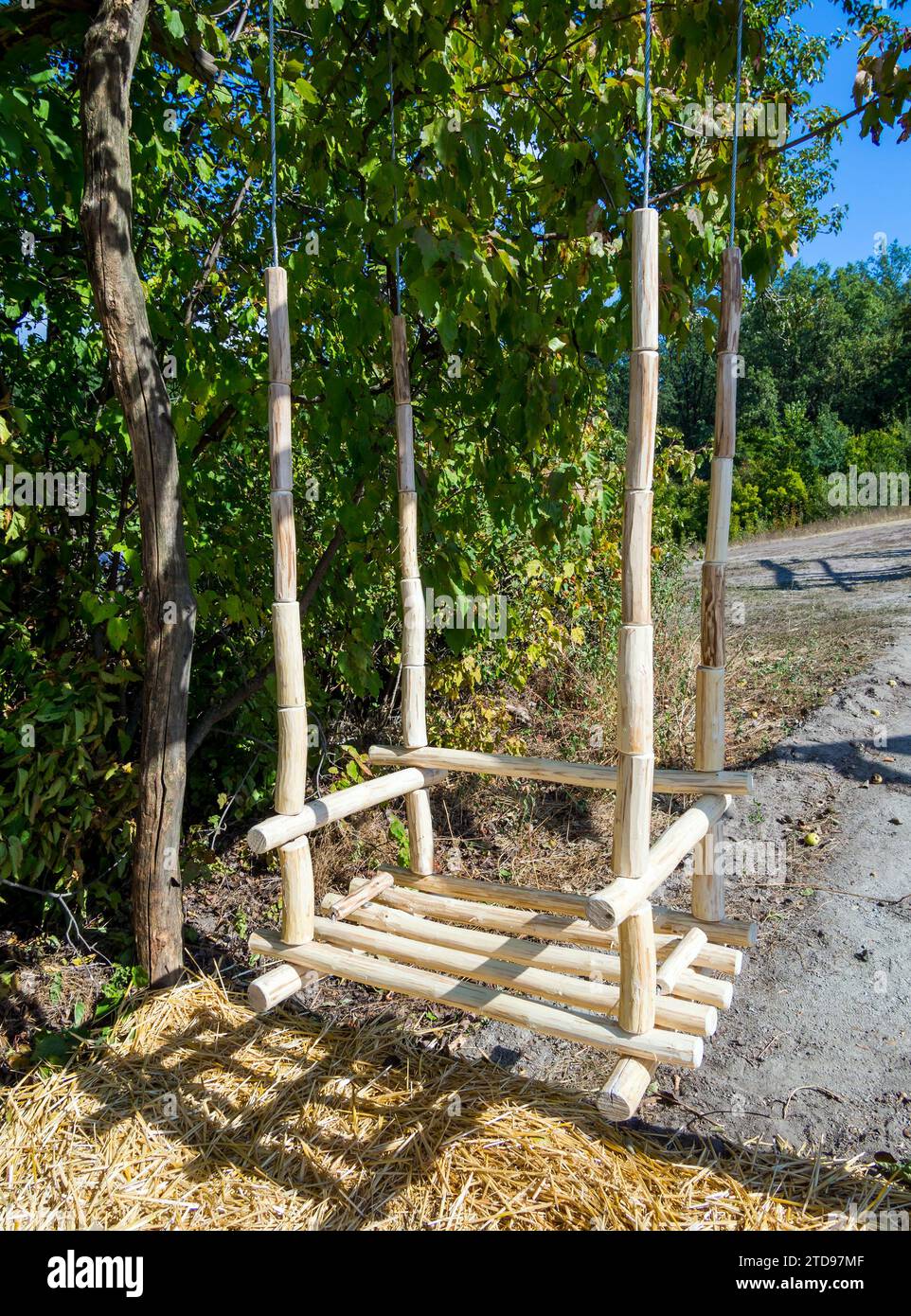 Homemade swing from wooden poles Stock Photo - Alamy