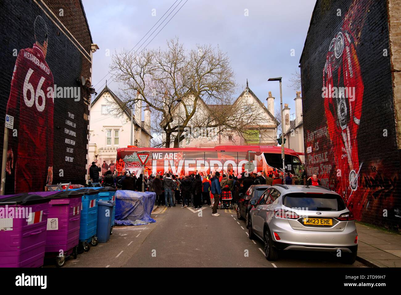 Fans gather as the Liverpool team bus arrives at the stadium ahead of ...
