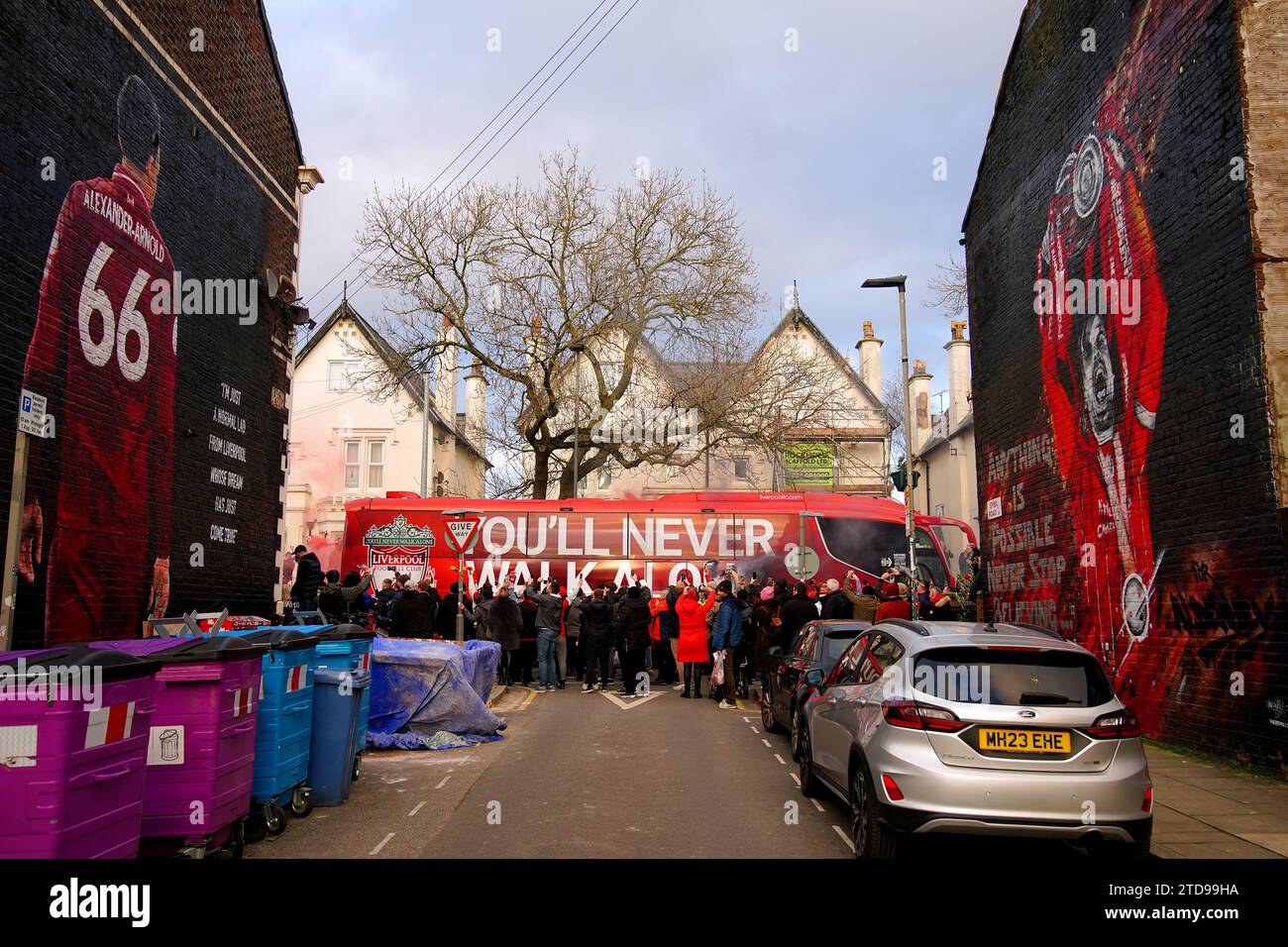 Fans gather as the Liverpool team bus arrives at the stadium ahead of ...