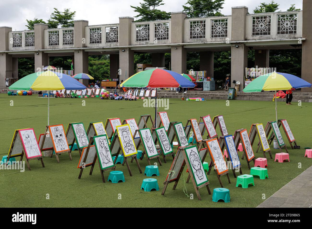 The drawing board is ready and neatly arranged on the green field for children to use in ...