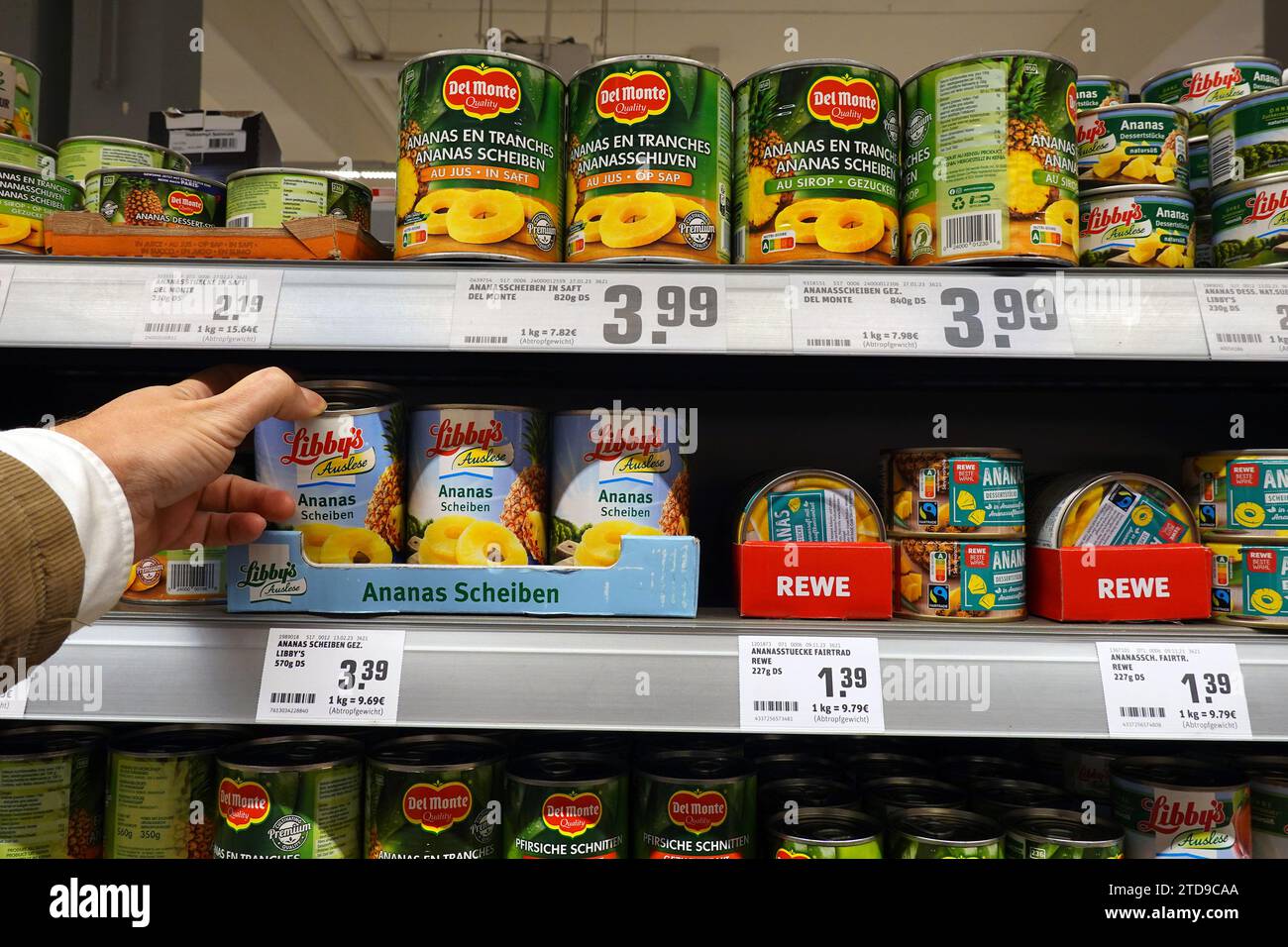 Canned fruit in a grocery Stock Photo - Alamy