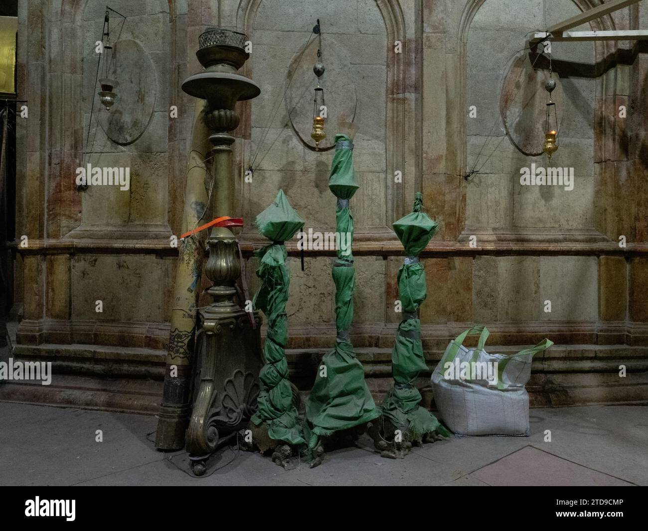 Big candle holders warp in green tarp due to the renovations held in ...