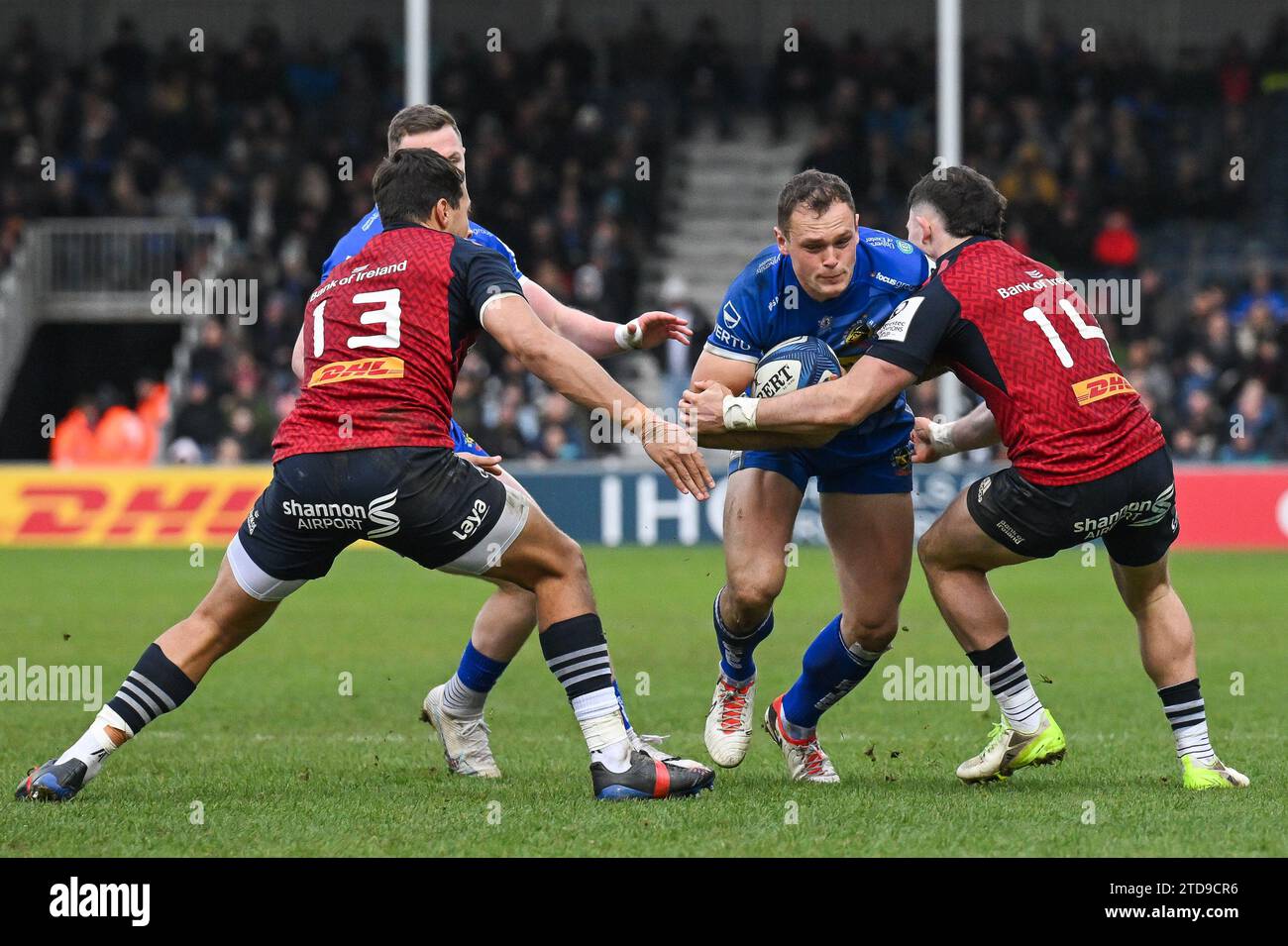Tommy Wyatt of Exeter Chiefs is tackled by Calvin Nash of Munster ...