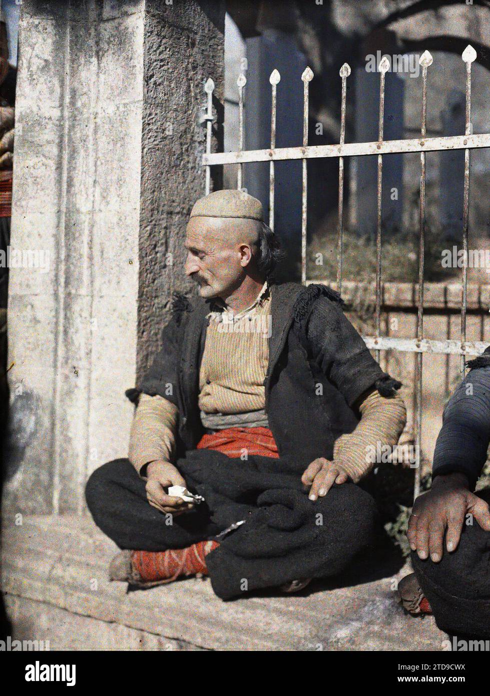 Tirana, Albania A man sitting under the arcades of the türbe (mausoleum ...