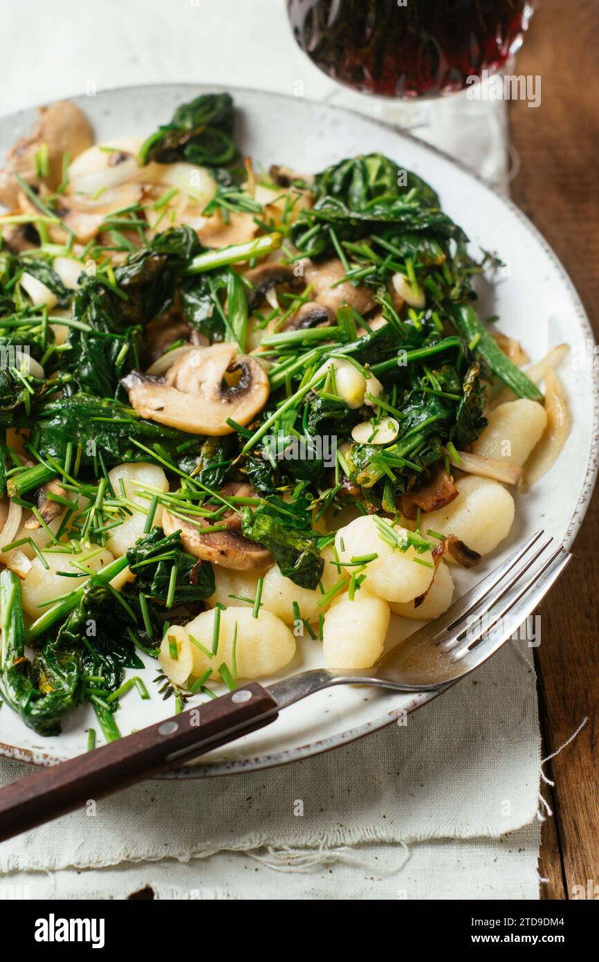 Gnocchi with Mushrooms and Spinach Stock Photo - Alamy