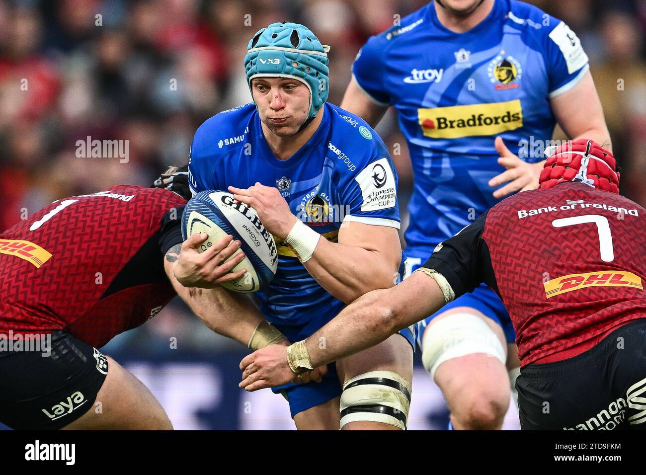 Ross Vintcent of Exeter Chiefs is tackled by Jeremy Loughman and John ...