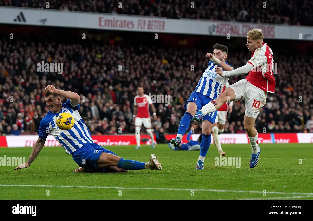 Brighton and Hove Albion's Lewis Dunk (left) gets hits in the face off ...