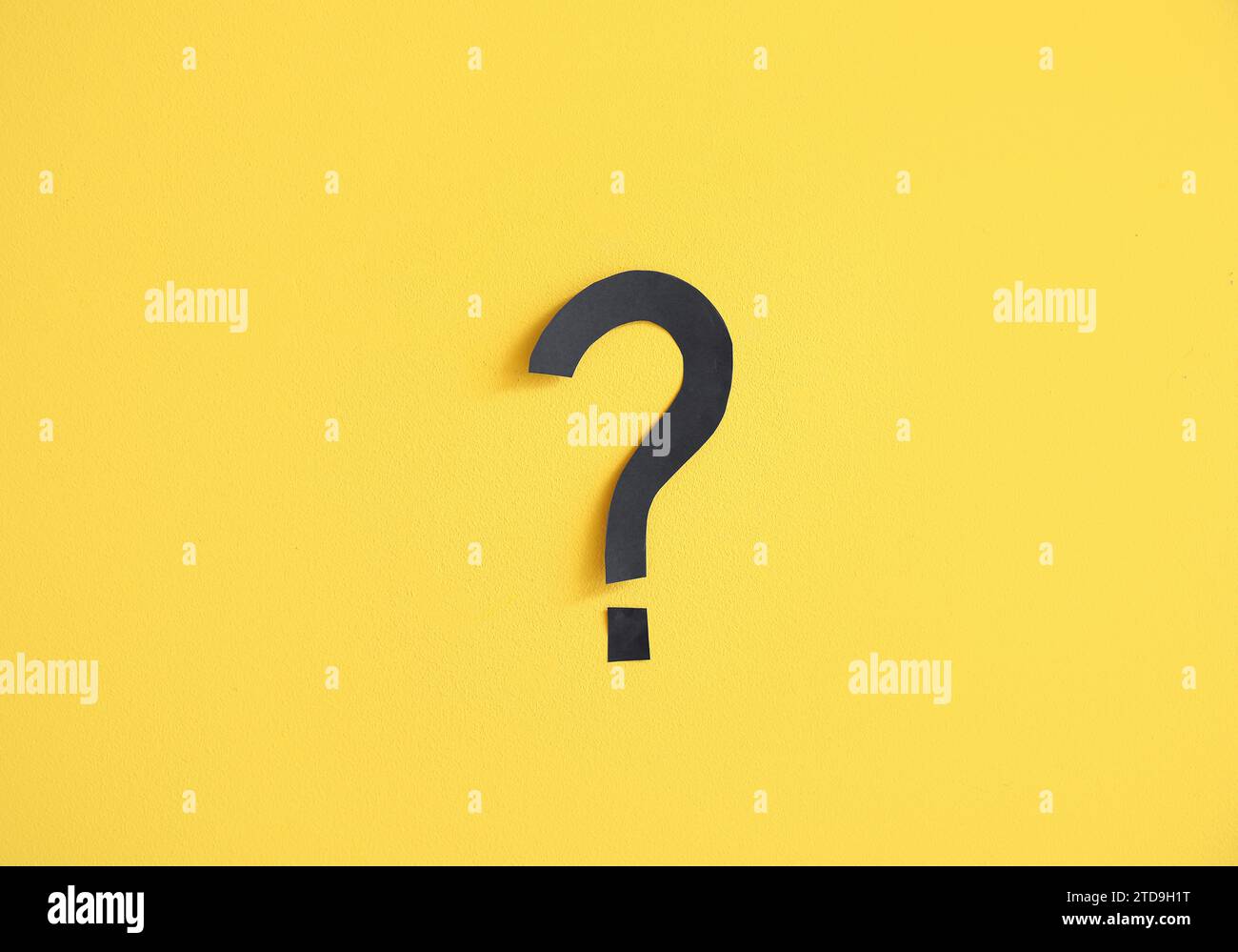 Paper question mark on yellow background Stock Photo - Alamy