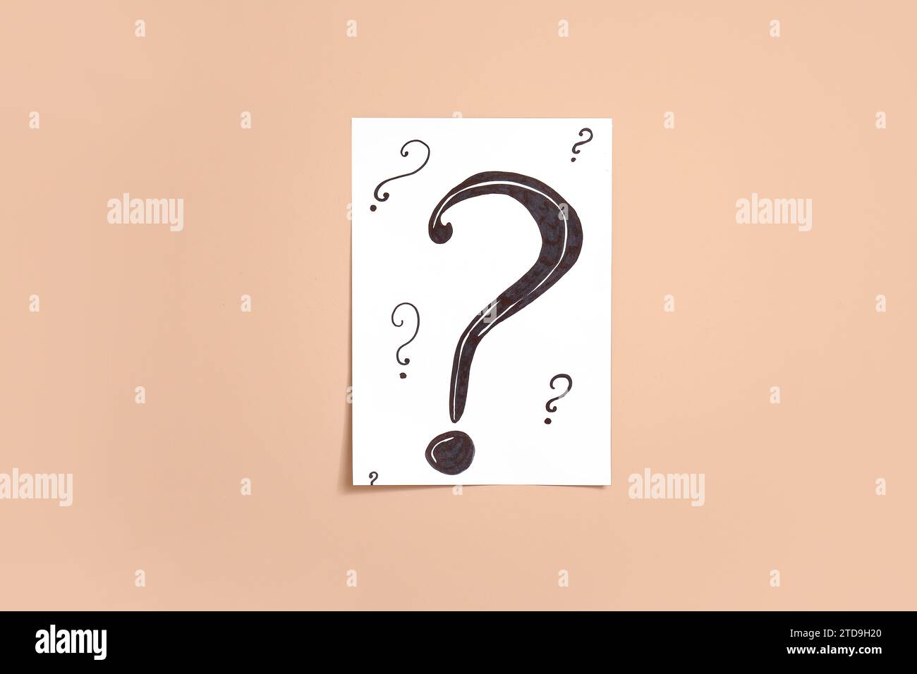 Paper with question marks on beige background Stock Photo - Alamy