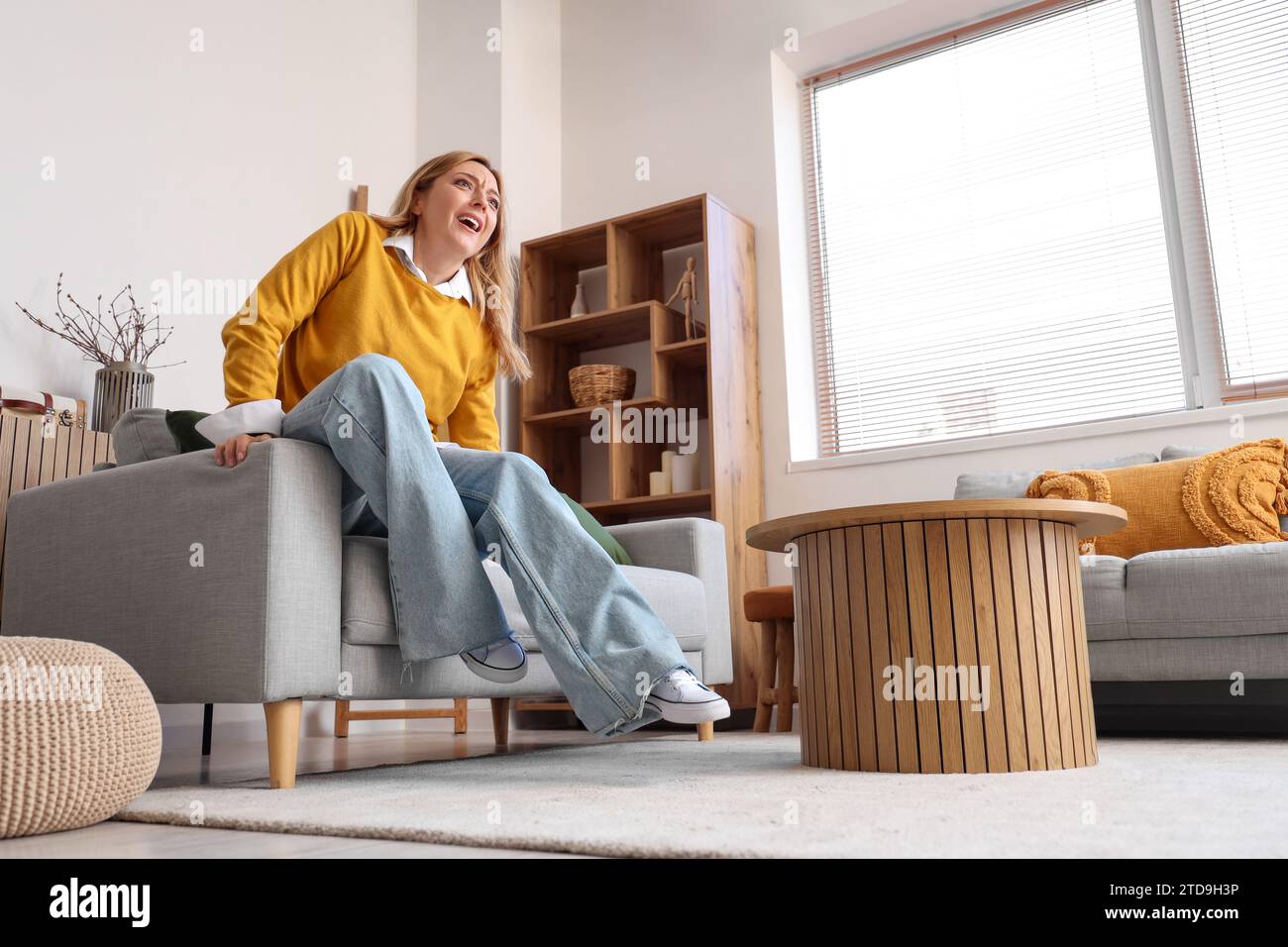 Scared mature woman at home Stock Photo - Alamy