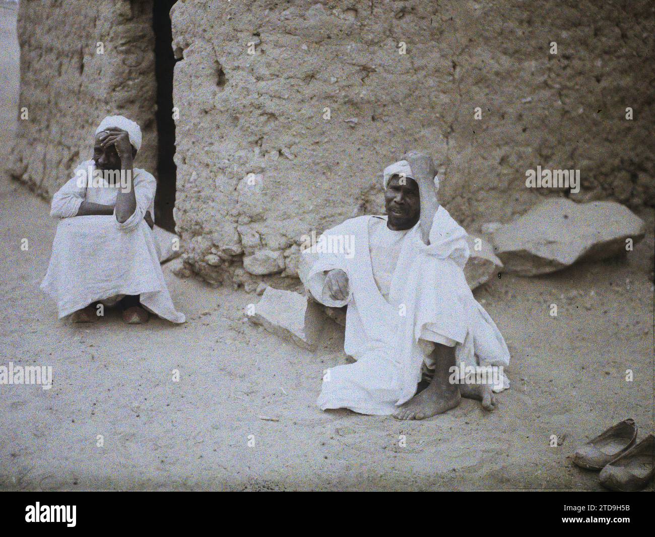 Aswan, Egypt, Africa Two Sudanese sitting on the ground in the village ...