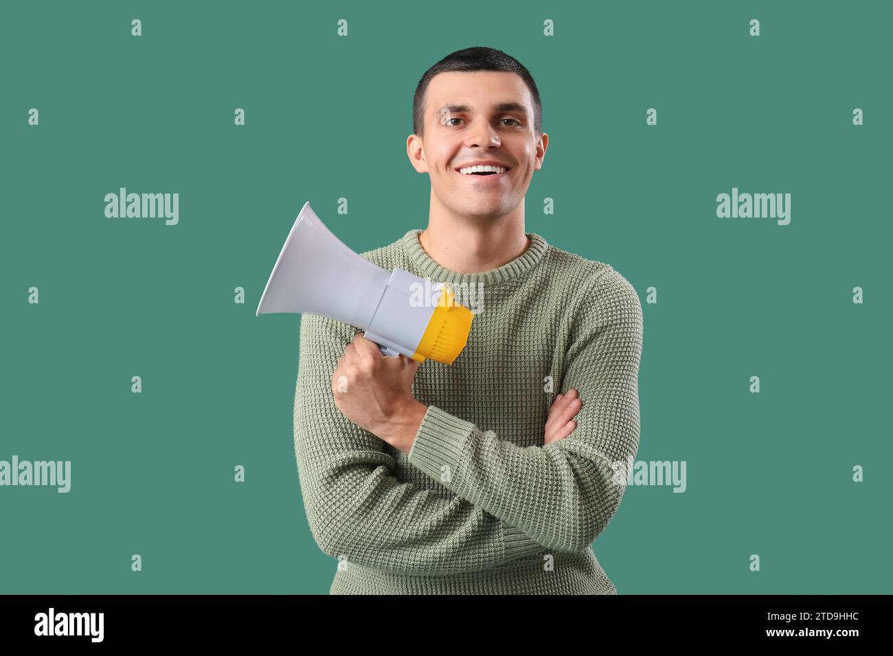 Smiling handsome man megaphone hi-res stock photography and images - Alamy