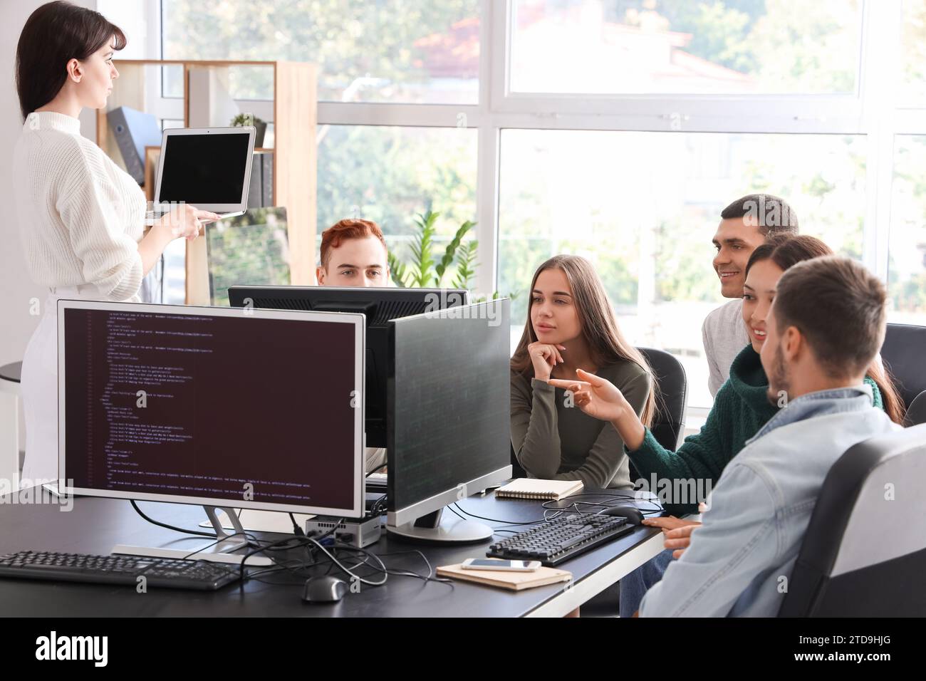 Team young programmers working hi-res stock photography and images - Alamy