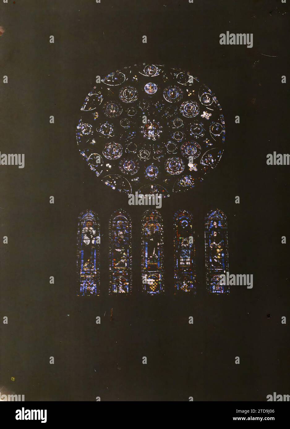 Chartres, France Stained glass windows of the rose and lancets of the ...