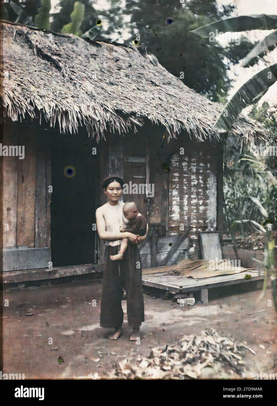 Tonkin, Indochina A young woman and child in front of a house, Human ...