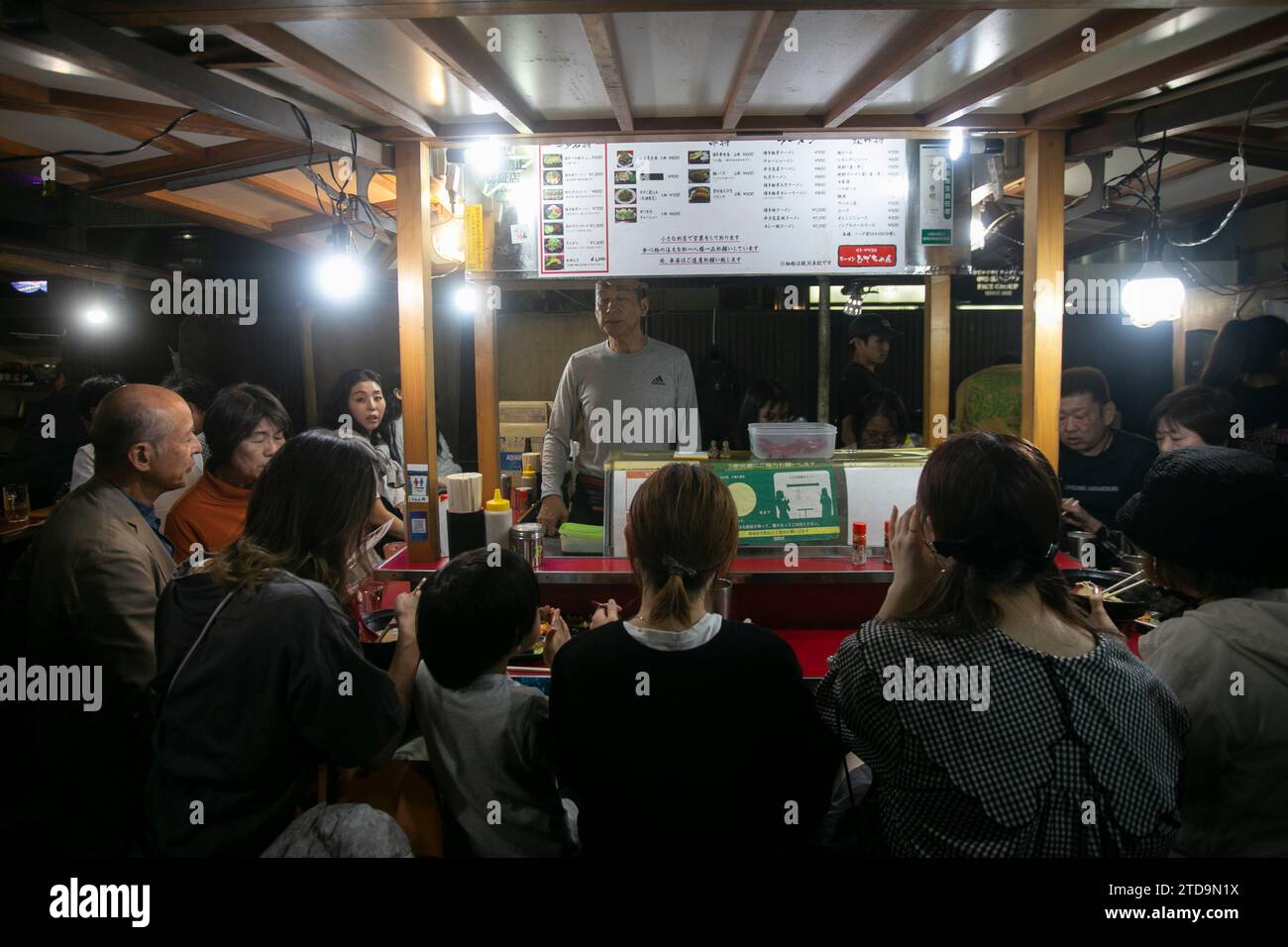 Fukuoka, Japan; 1st October 2023: People eating and drinking in a Yatai ...
