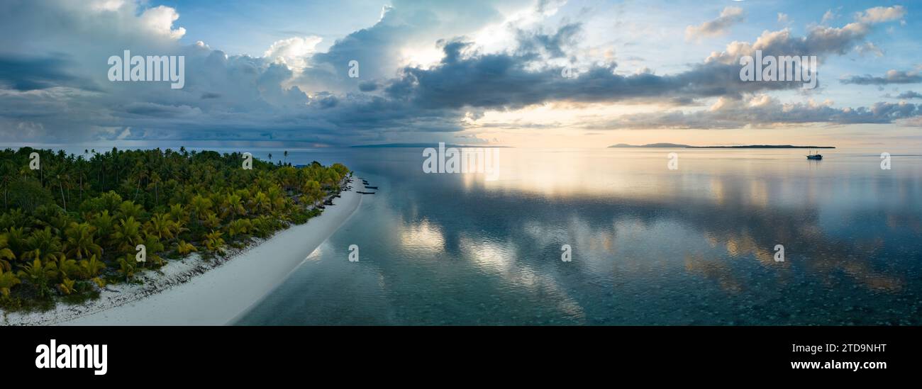 Sunrise illuminates the remote island of Koon near Seram, Indonesia ...