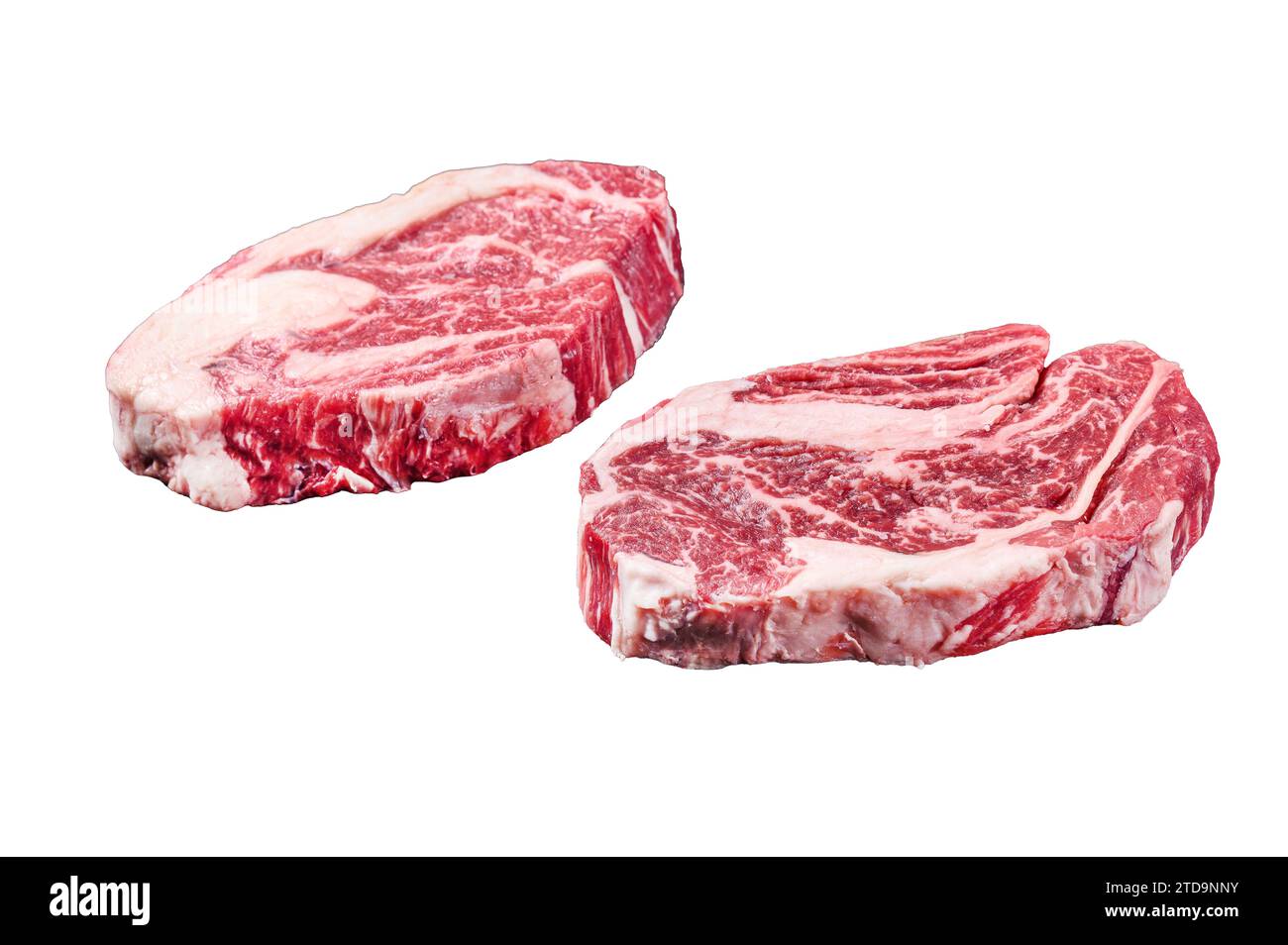 Raw chuck eye roll steaks, premium beef meat on a butcher board ...