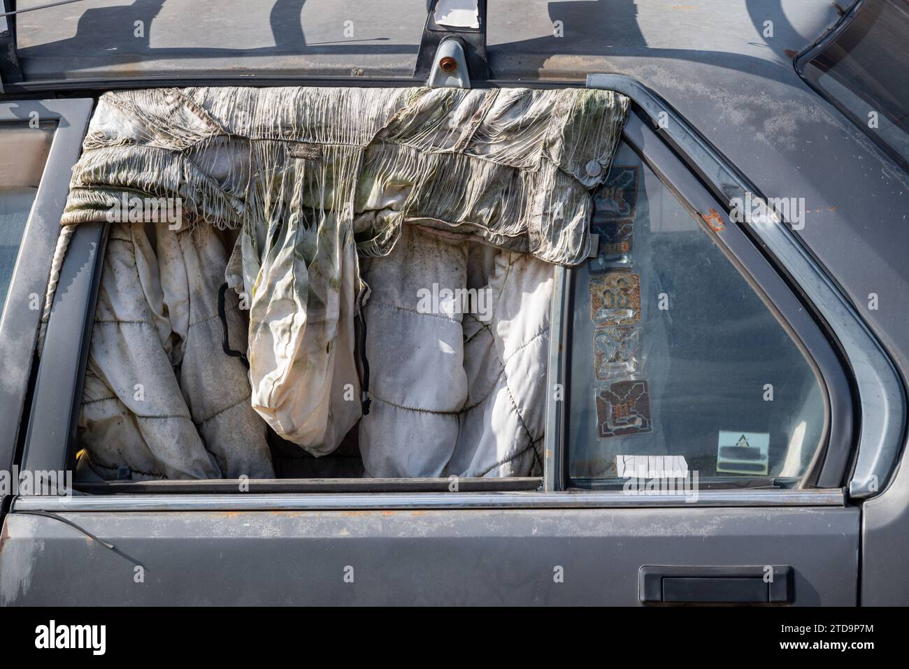 A car with a jacket as a replacement for a broken door window Stock ...
