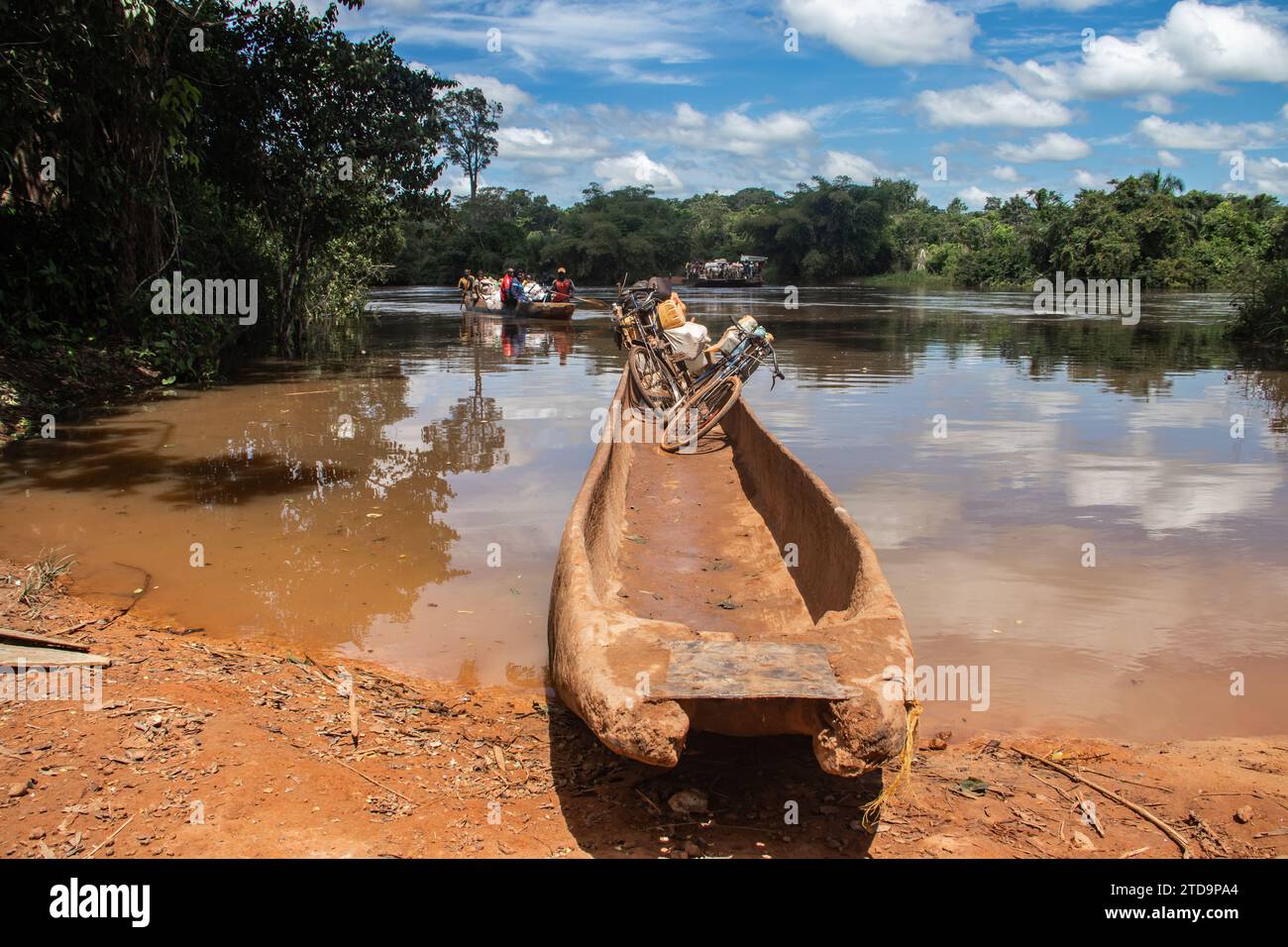 Transport of people across the Mbari river by locally made canoes and ...