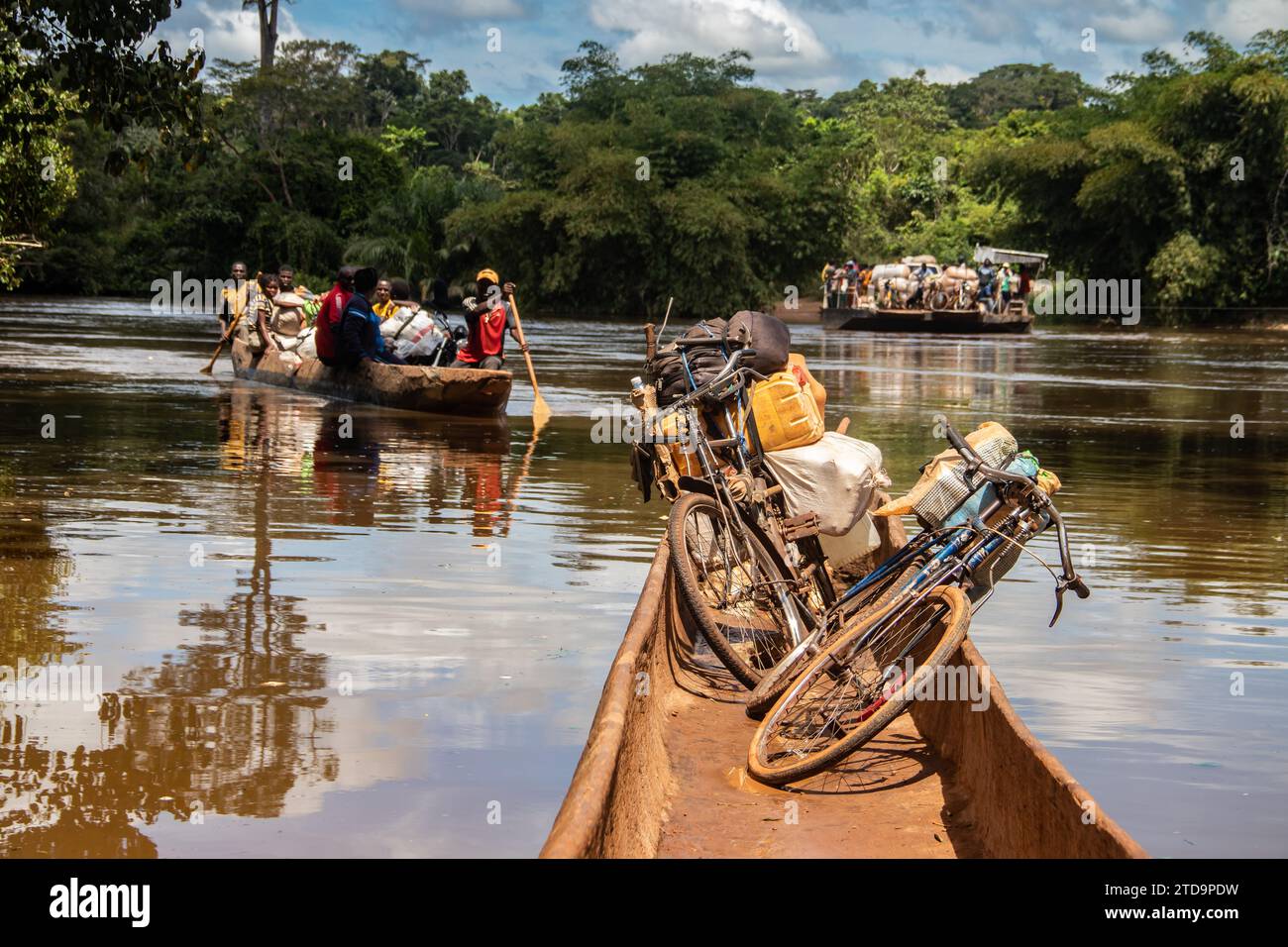 Transport of people across the Mbari river by locally made canoes and ...