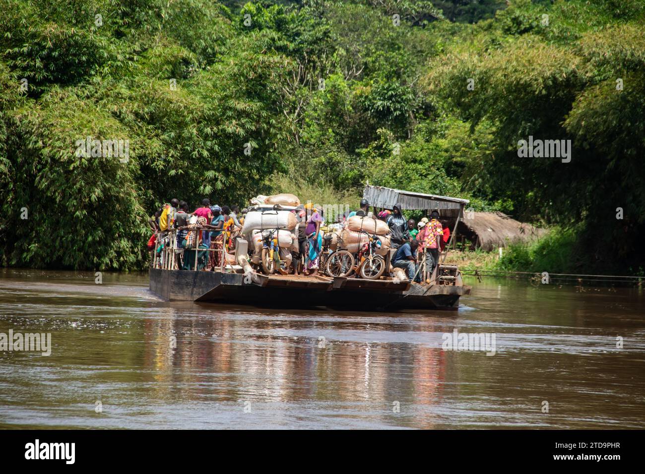 Transport of people across the Mbari river by locally made canoes and ...