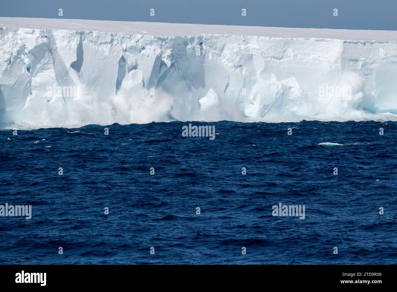 Antarctica, South Orkney Islands. Waves crashing on large tabular ...