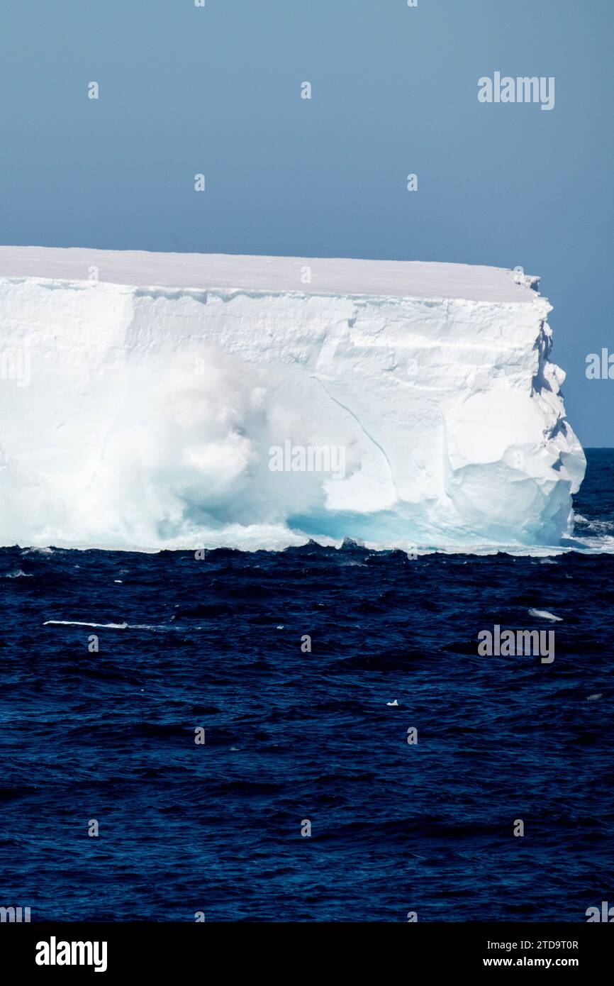 Antarctica, South Orkney Islands. Waves crashing on large tabular ...