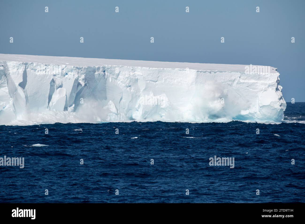 Antarctica, South Orkney Islands. Waves crashing on large tabular ...
