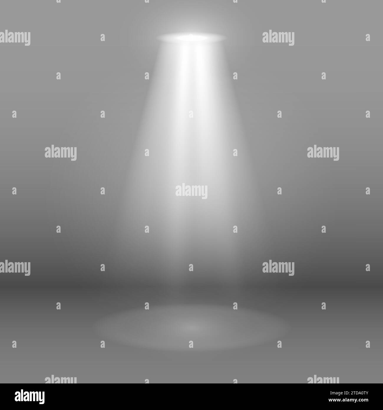 A spotlight with a bright white light illuminating the stage on a gray ...