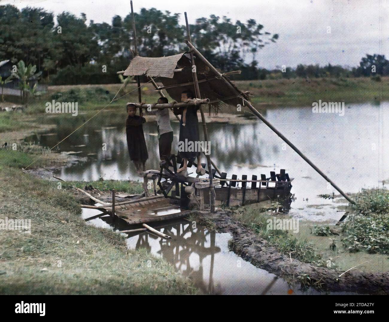 Tonkin, Indochina Children using a walking machine, water lift system ...