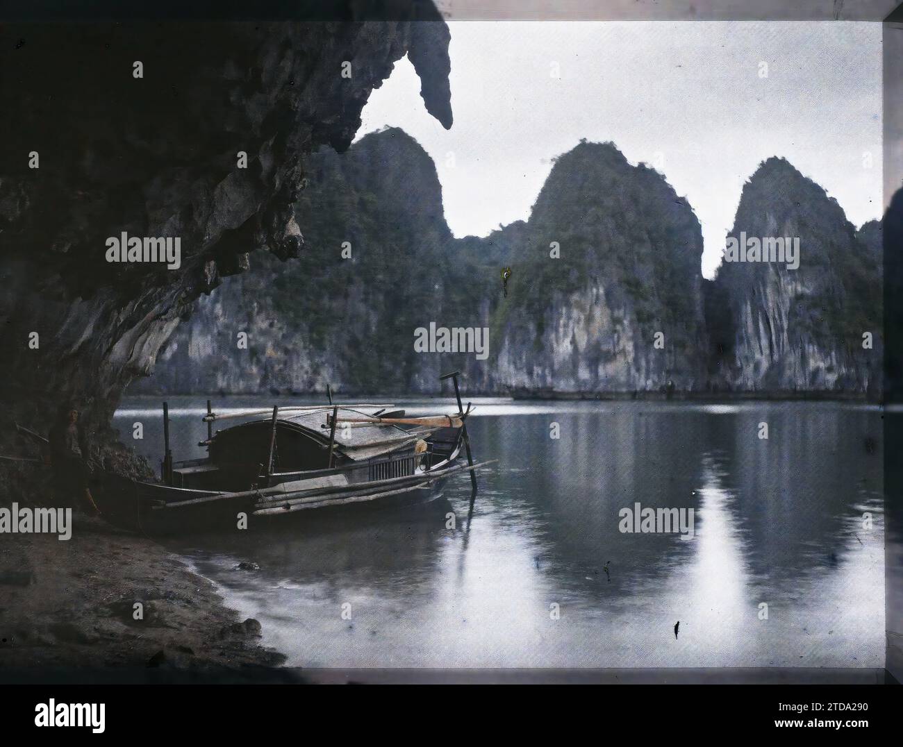 Ha-long Bay, Tonkin, Indochina A sampan docked in the Cirque de la ...