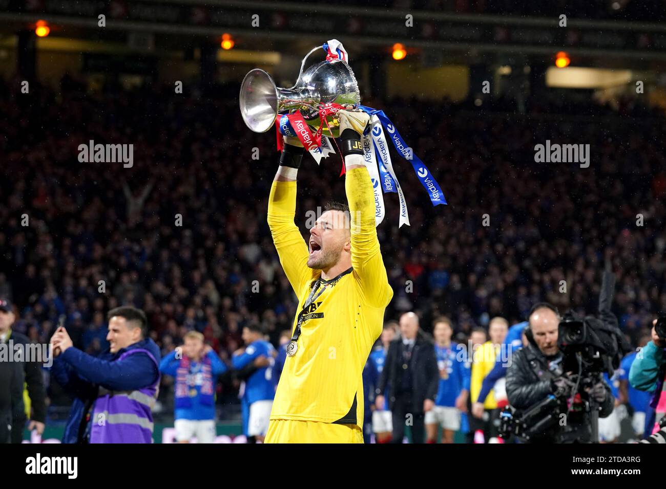 Rangers goalkeeper Jack Butland celebrates with the trophy after ...