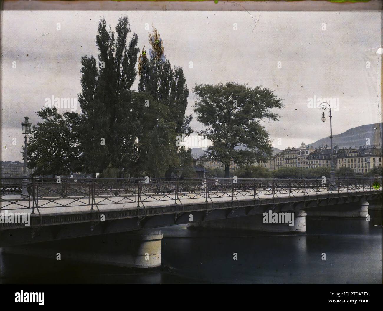 Geneva, Switzerland The Bergues Bridge and Rousseau Island on the Rhône ...