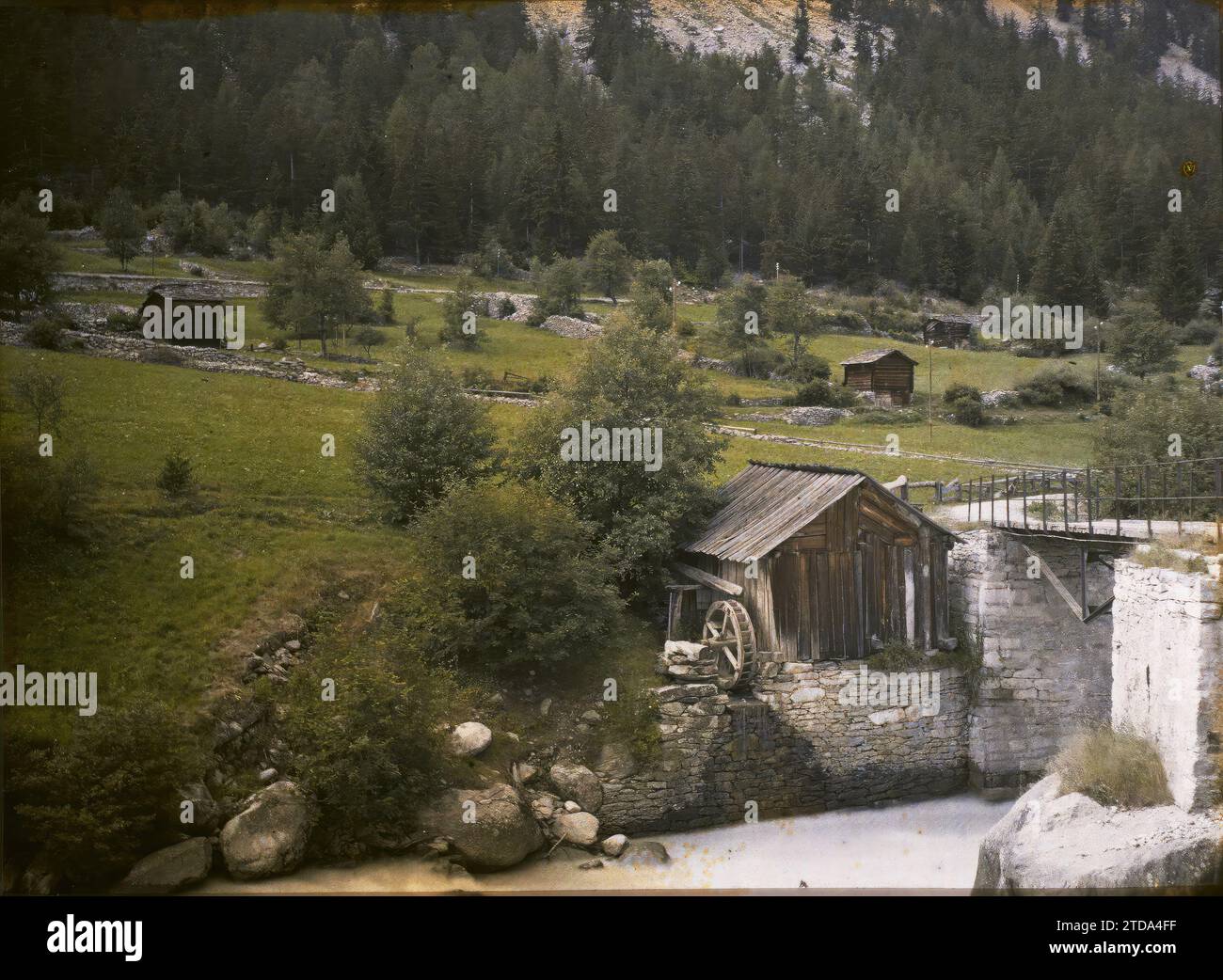 Saint-Nicolas, Switzerland A water mill and a bridge over the Visp ...