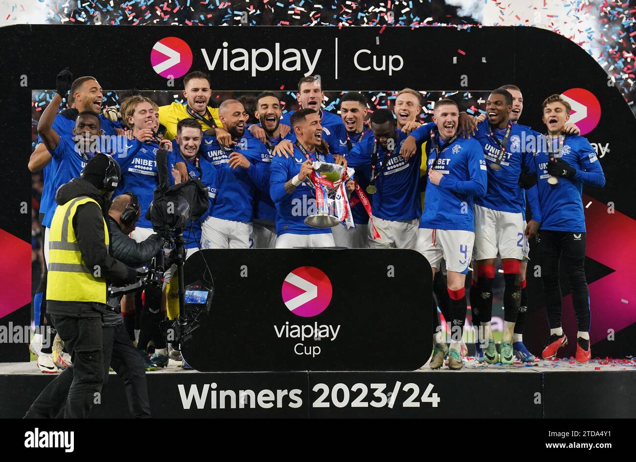 Rangers' James Tavernier lifts the trophy with team-mates after victory ...
