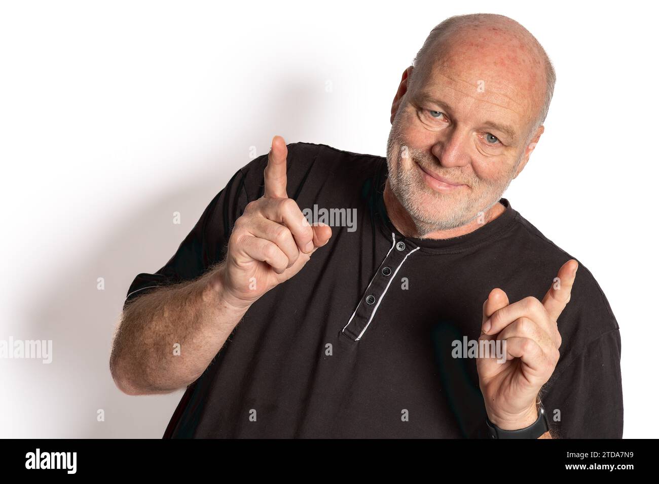Confident 58-Year-Old White Male Pointing Up, Portrait on White ...