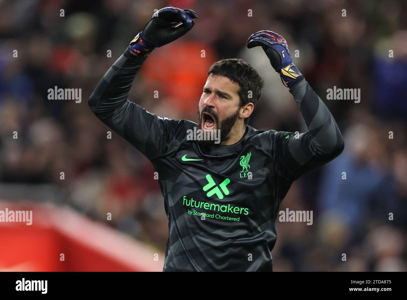 Liverpool, UK. 17th Dec, 2023. Alisson Becker of Liverpool gees up the ...