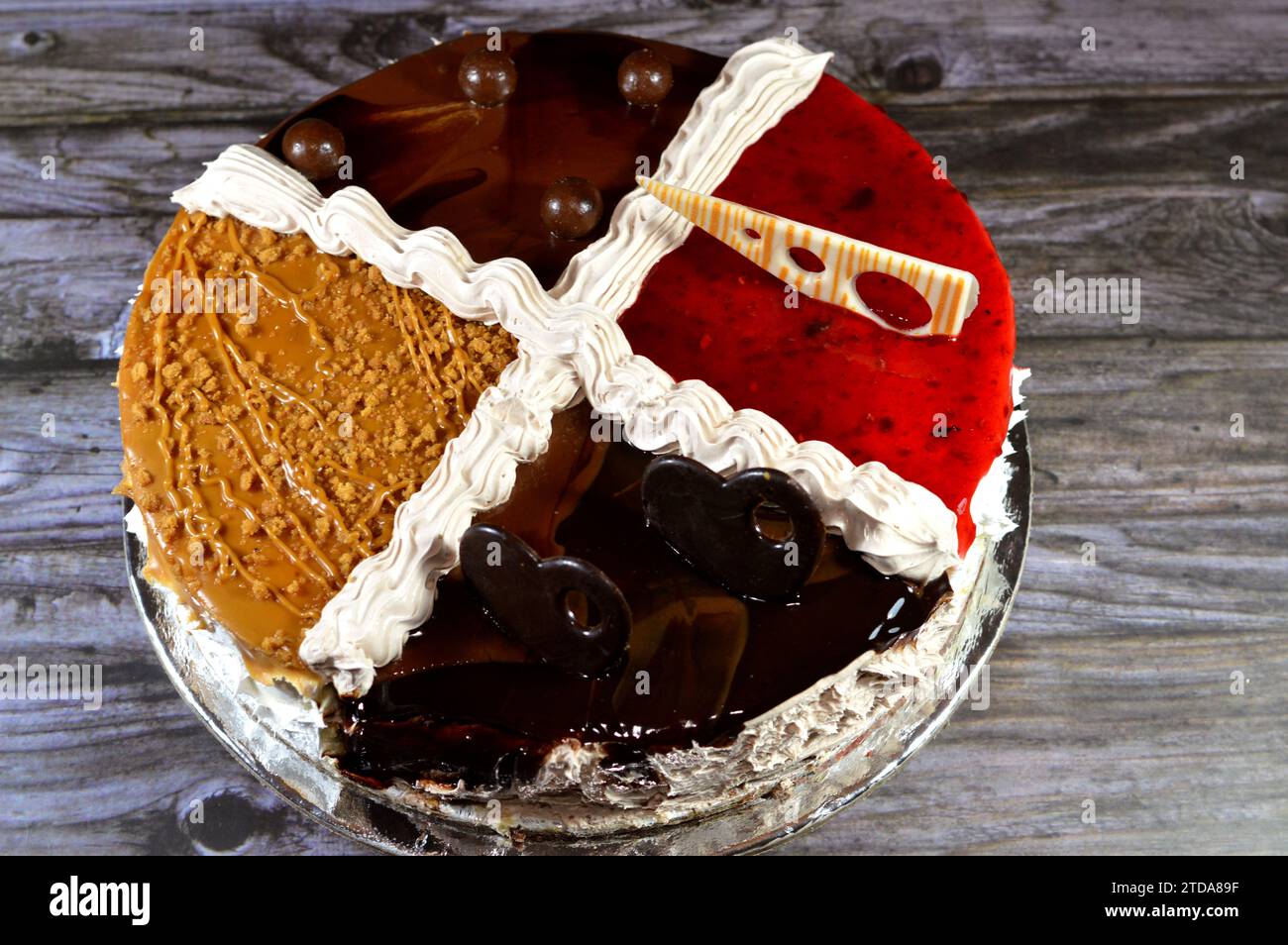 A birthday cake, four different quarters spongy creamy cake for ...