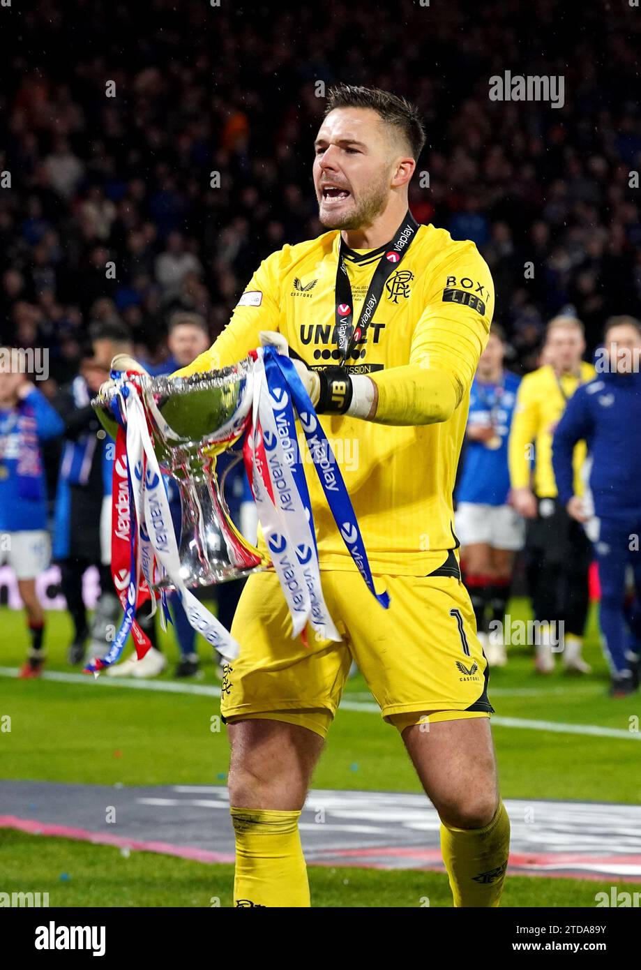 Rangers goalkeeper Jack Butland celebrates with the trophy after ...