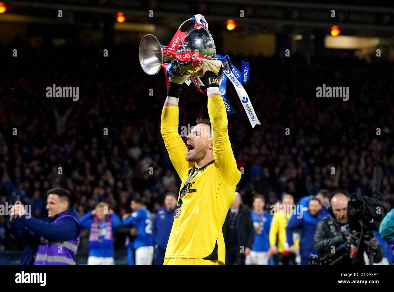 Rangers goalkeeper Jack Butland celebrates with the trophy after ...