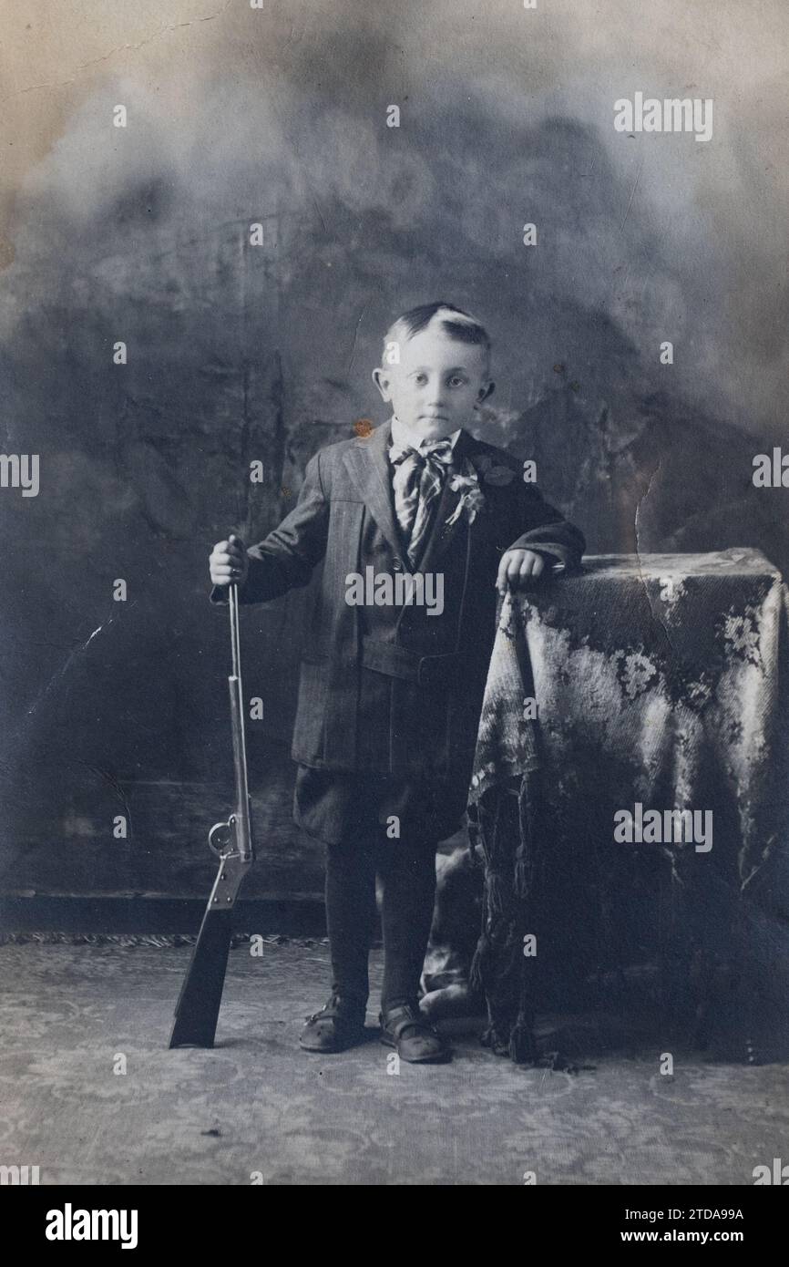 Boy with rifle hi-res stock photography and images - Alamy