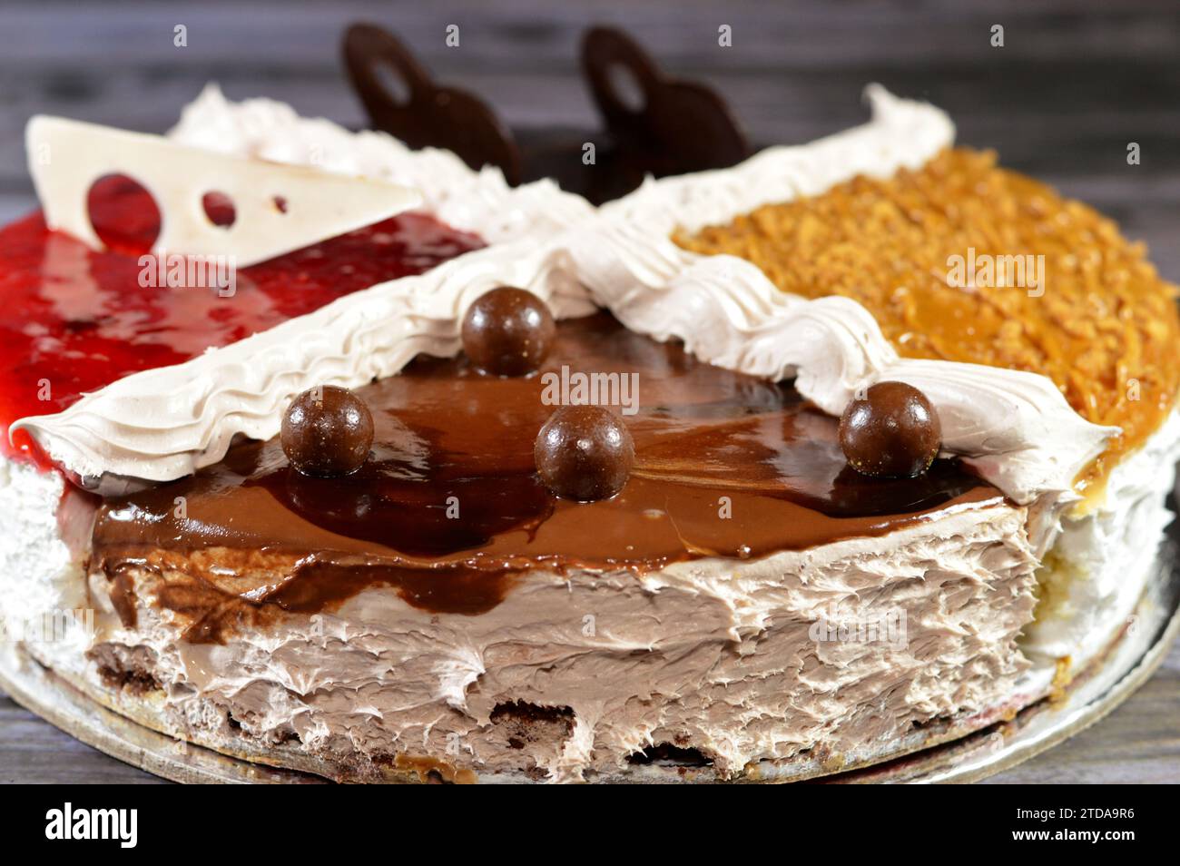 A birthday cake, four different quarters spongy creamy cake for ...