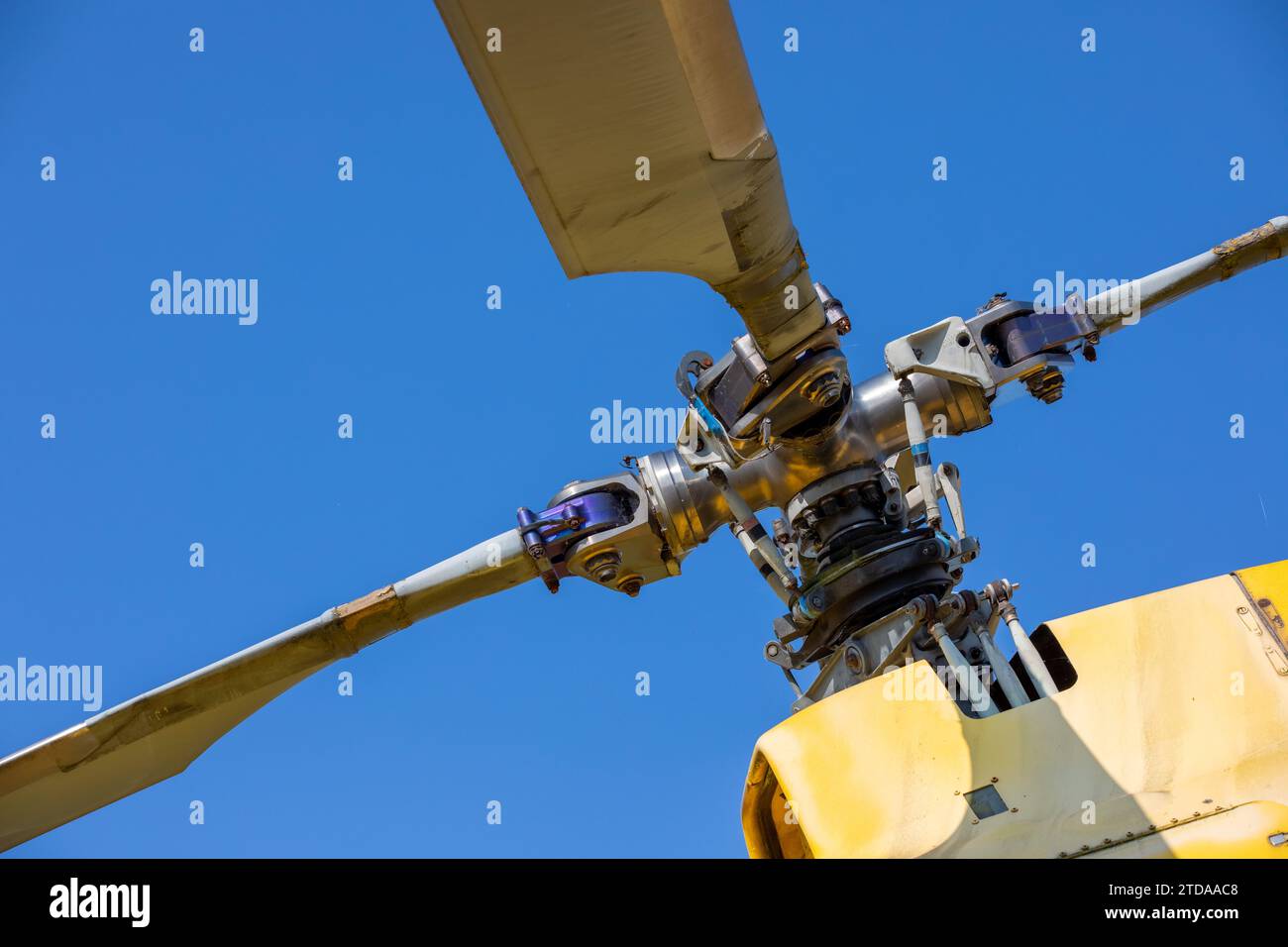 Vintage Charm: The Weathered Rotors of a Yellow Old Helicopter Unveil ...