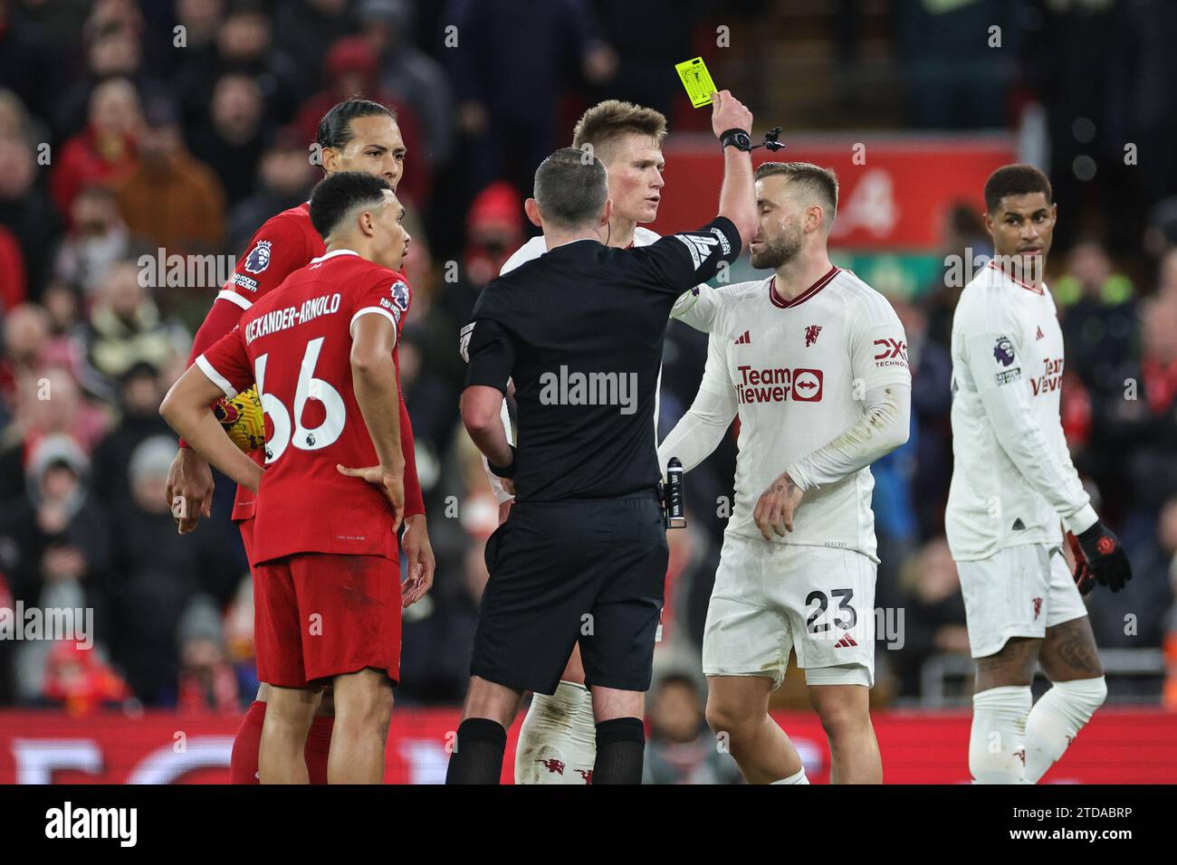 Liverpool, UK. 17th Dec, 2023. Referee Michael Oliver gives a yellow ...