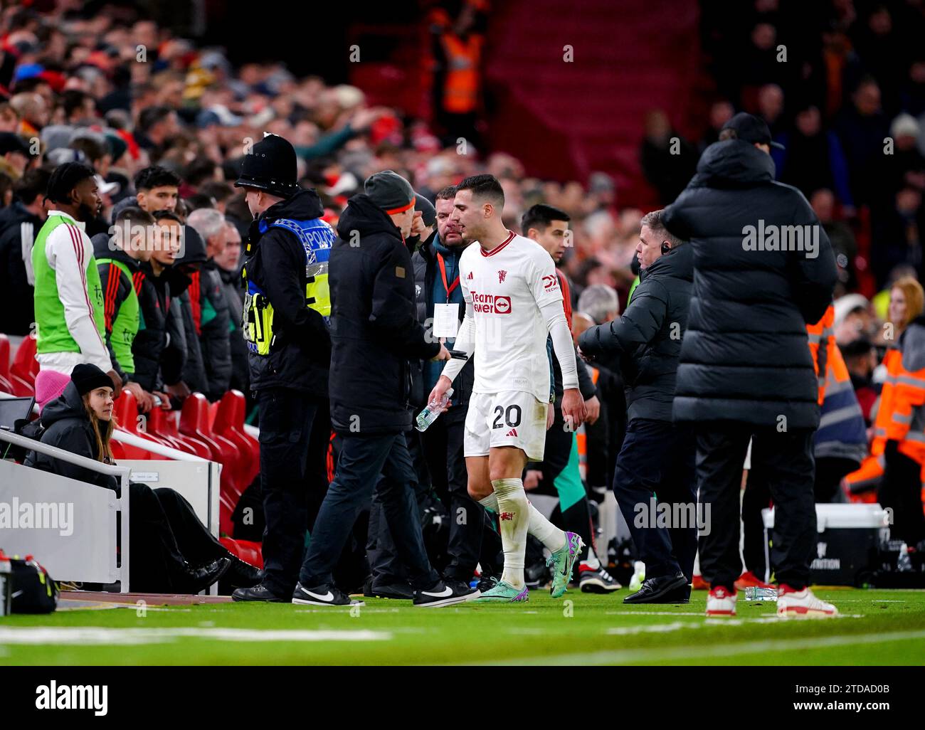 Manchester United's Diogo Dalot leaves the pitch after being shown a ...