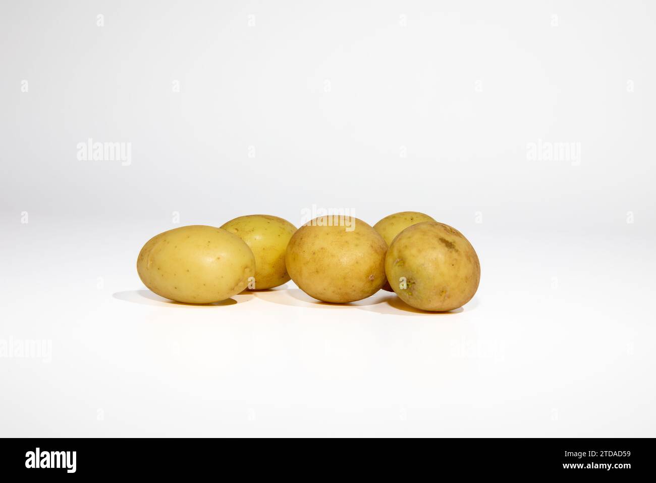Group of fresh baby potatoes isolated on white background close up ...