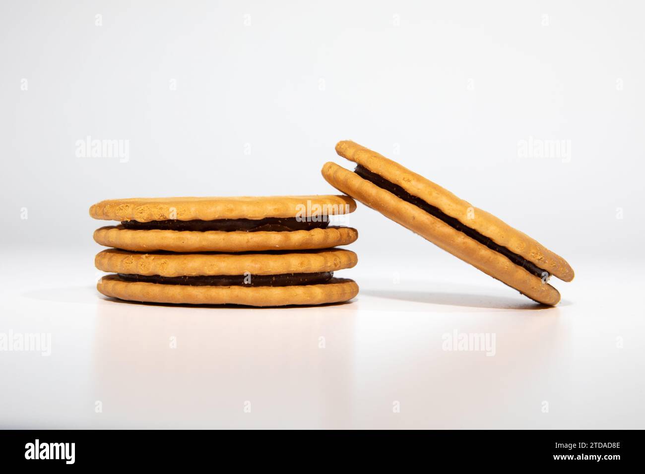 Double biscuit with cocoa cream filling on white background Stock Photo ...