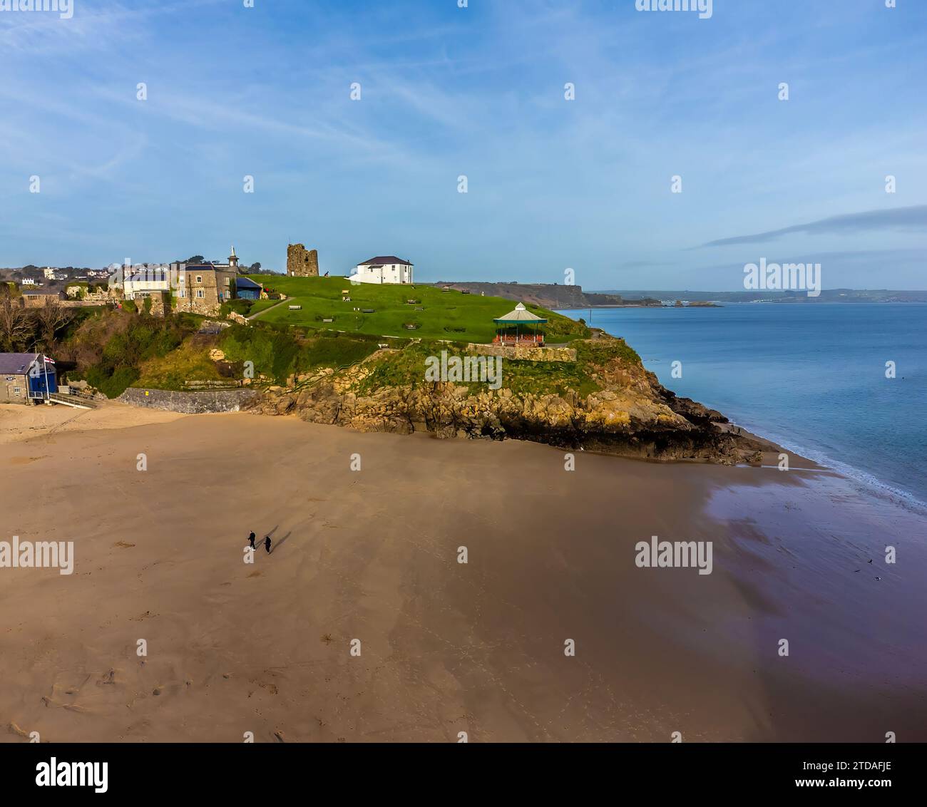 An aerial view from the South beach towards Castle Hill in Tenby, Wales ...